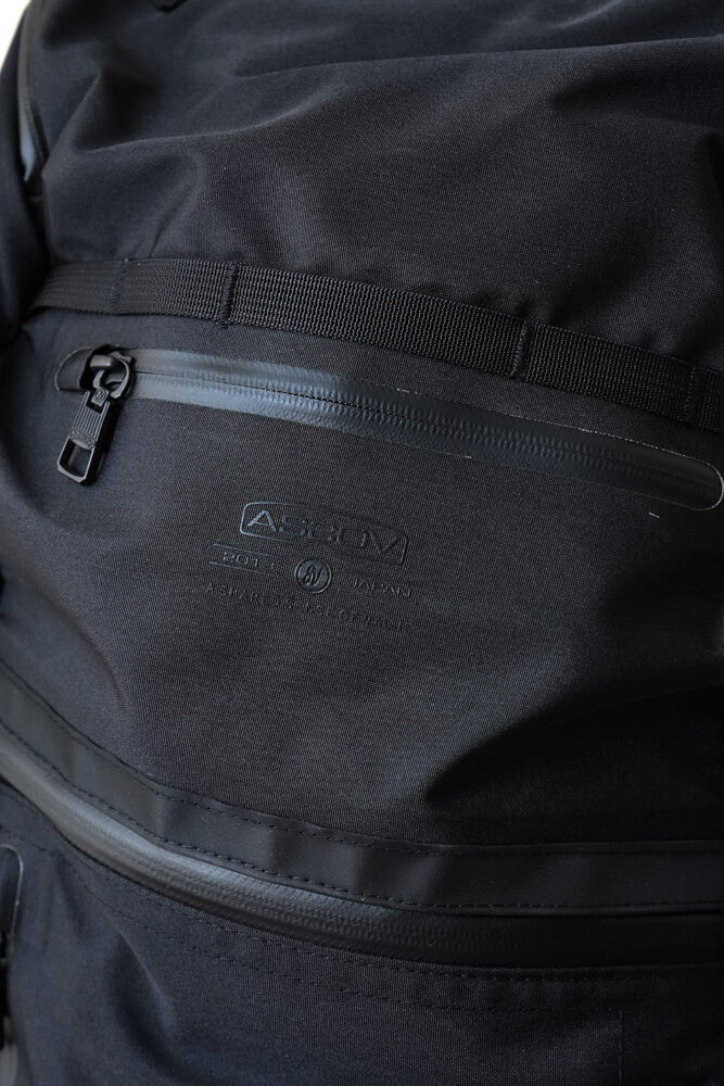 「ASSOV」WATER PROOF CORDURA 305D ROUND ZIP BACKPACK | ANOTHER LOUNGE